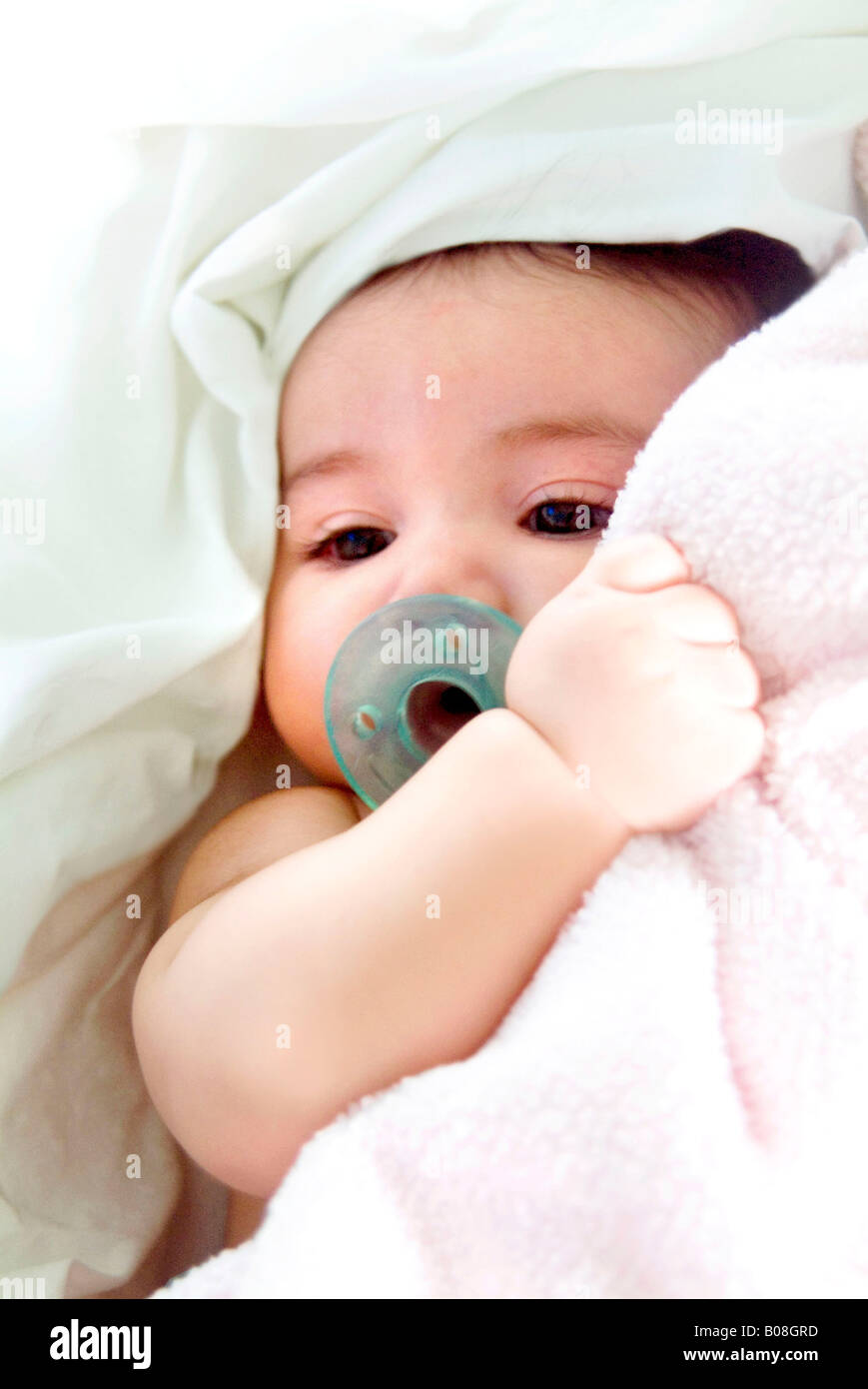 Portrait of baby with pacifier Stock Photo - Alamy