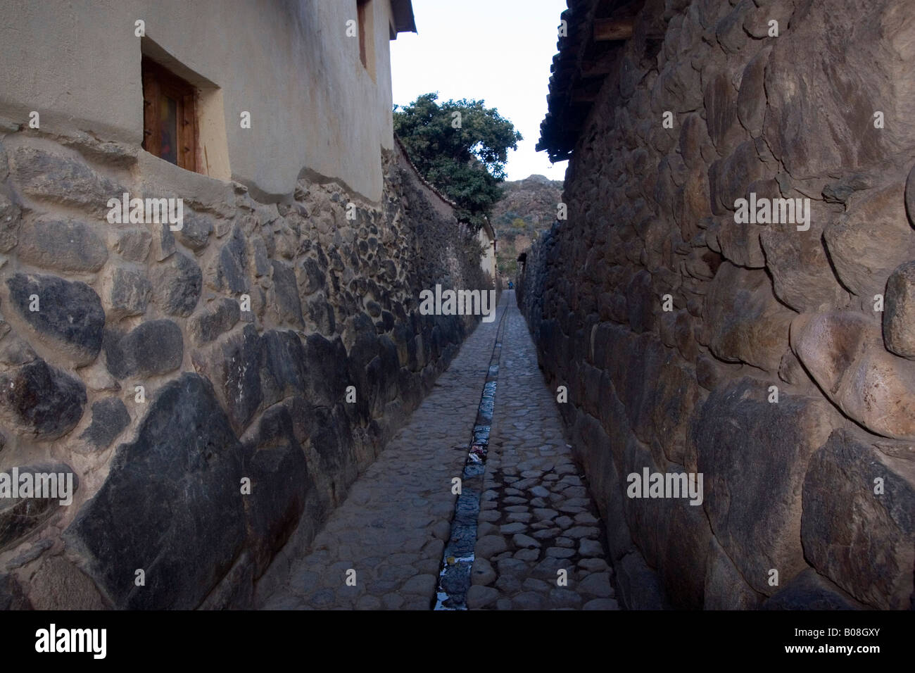 South America - Peru. Cobblestone street with drainage channel and Inca ...