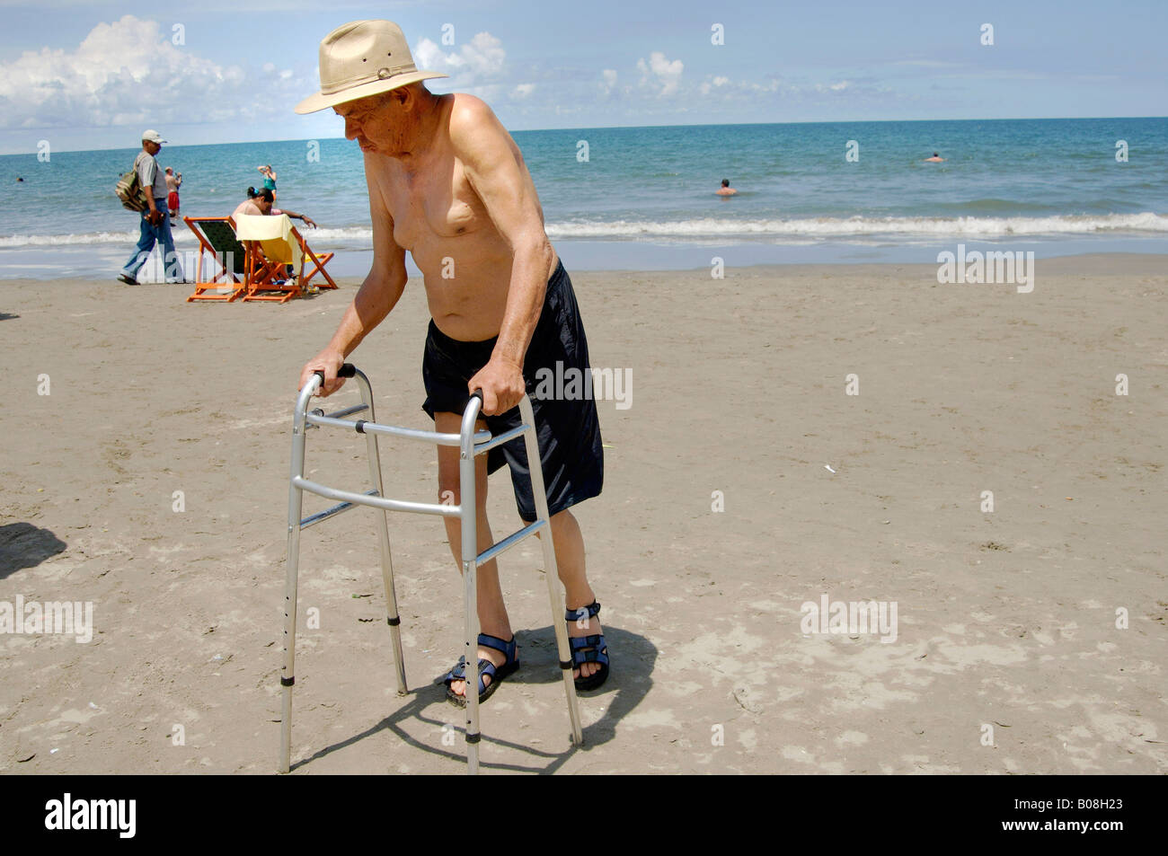 Elderly men line beach hi-res stock photography and images - Alamy