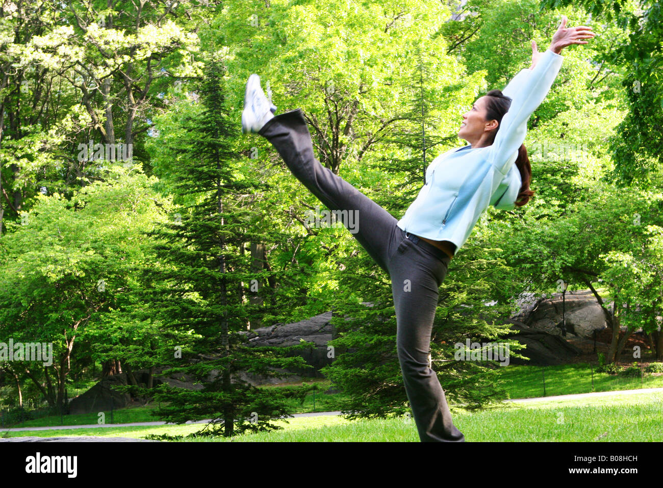 Woman exercising at the park Stock Photo - Alamy