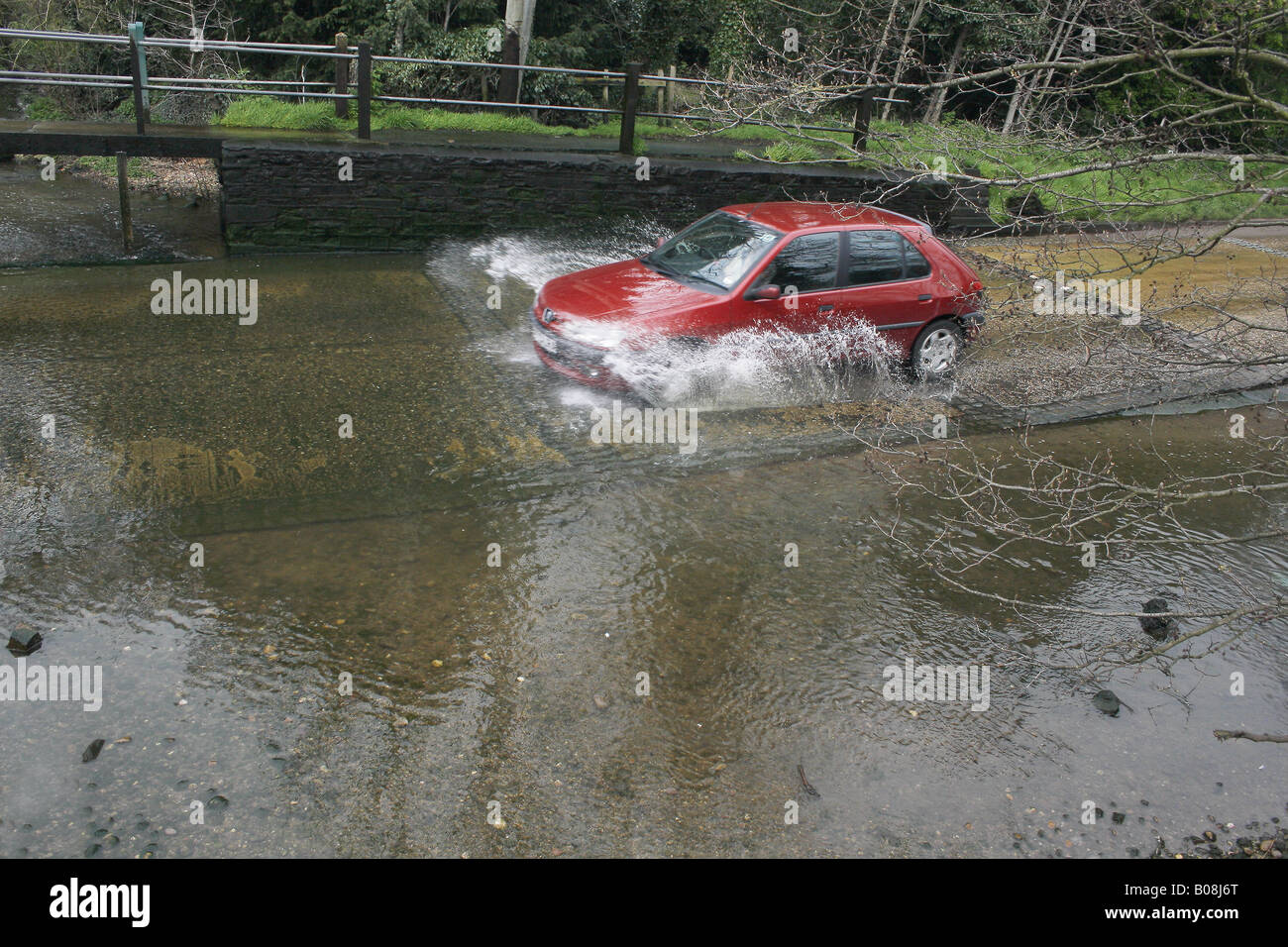 car driving through ford Stock Photo - Alamy