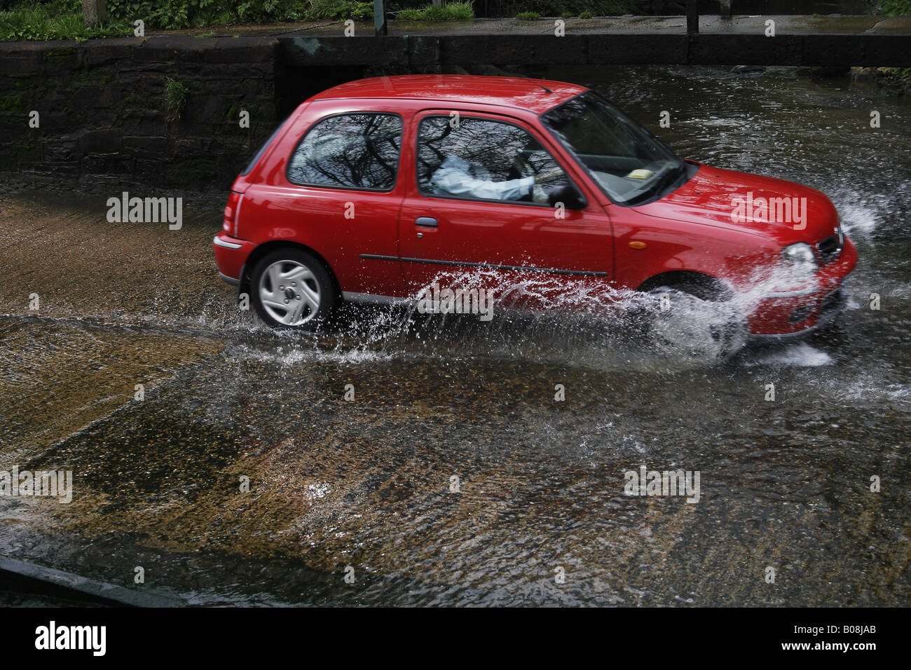 car driving through ford Stock Photo - Alamy