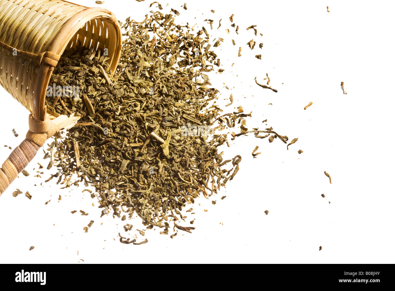 An overspilling scoop of raw tea Stock Photo - Alamy