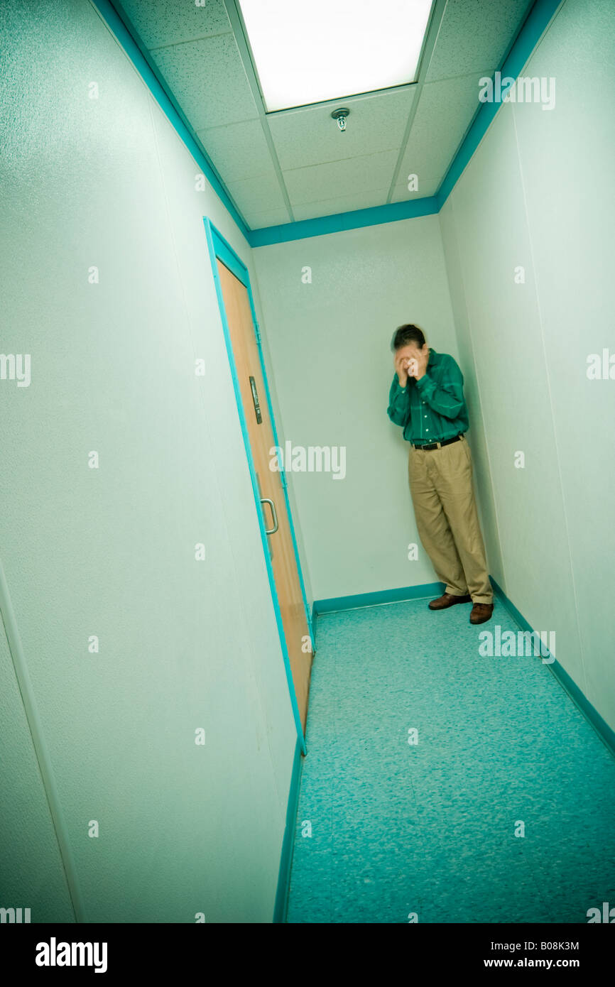 Frustrated man leaning head wall hi-res stock photography and images ...