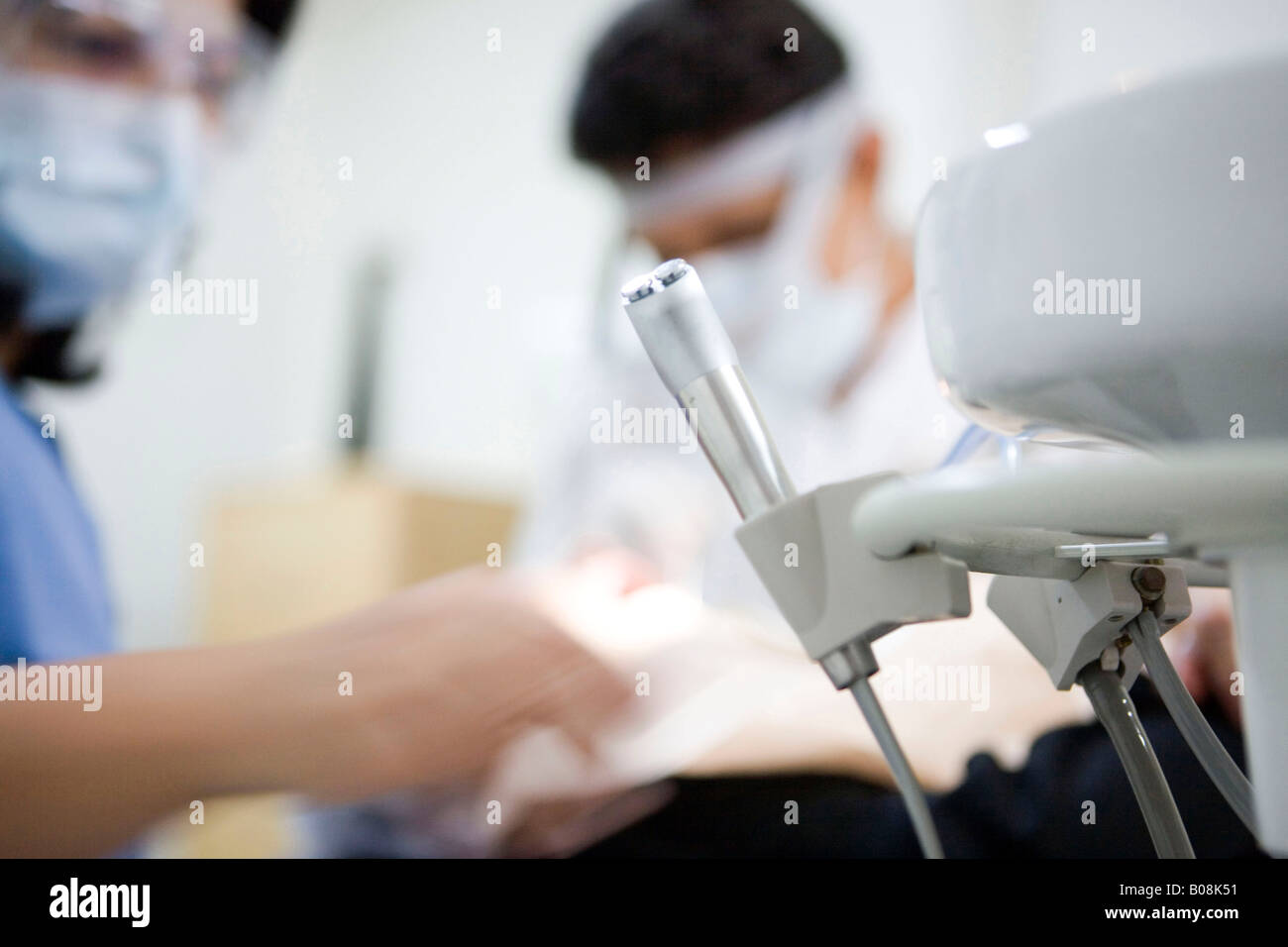 Dentist performing examination with medical assistant Stock Photo - Alamy