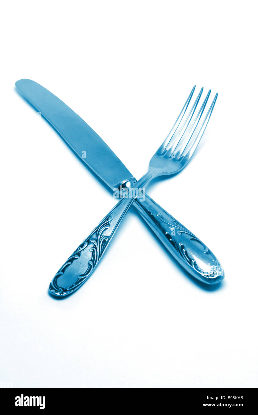 blue color knife and fork isolated on white background food industry ...