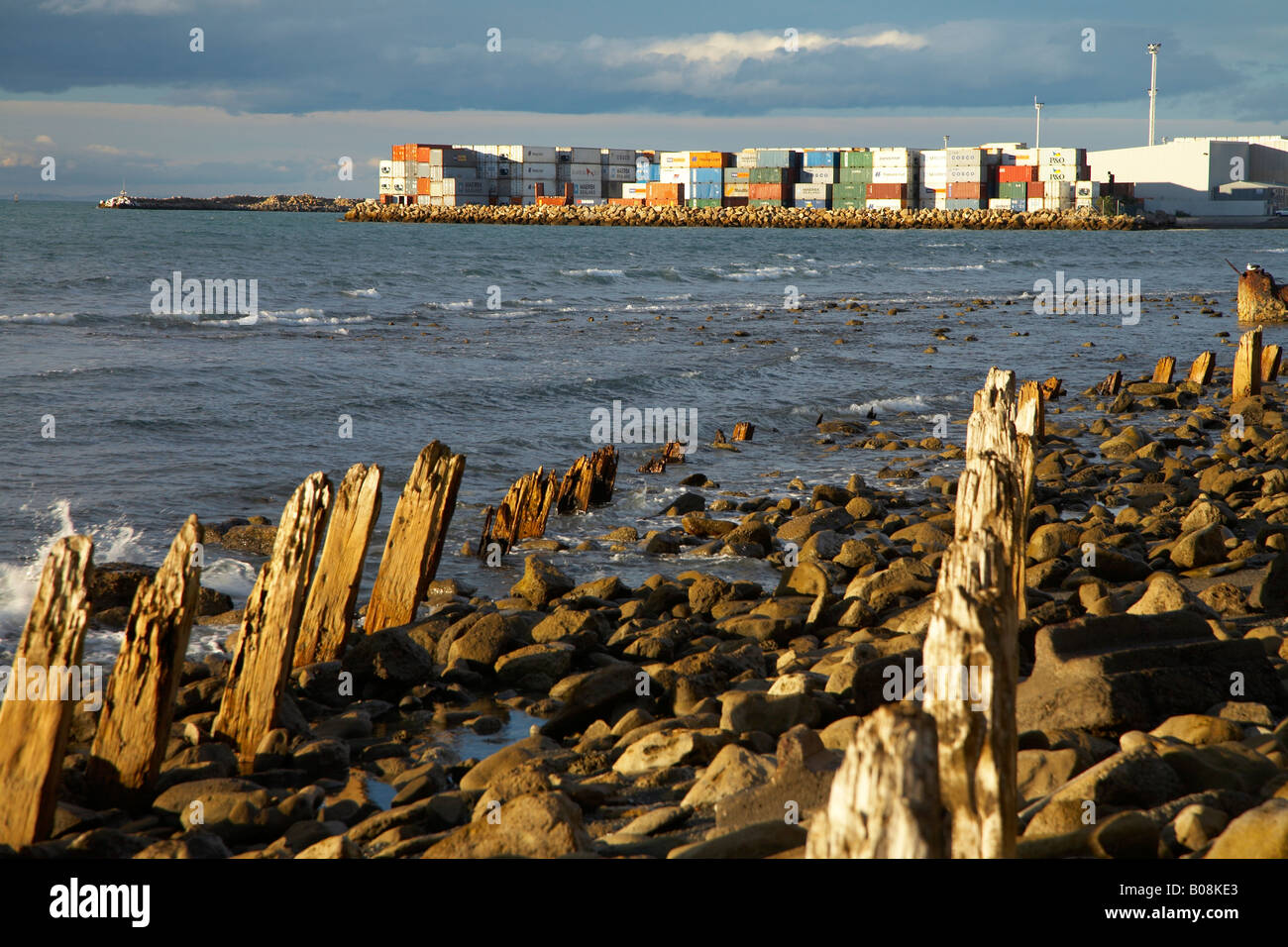 sea defences with napier port in the background Stock Photo - Alamy