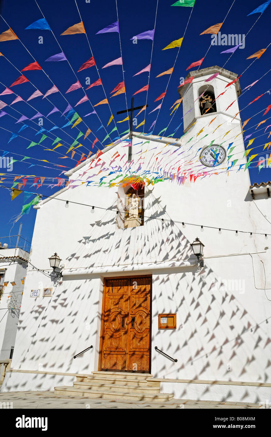Small colourful flags outside Santa Ana Church during fiesta, Altea la ...