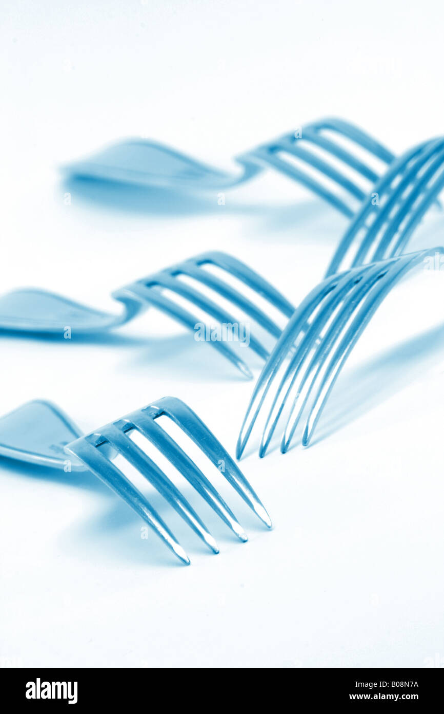 blue forks texture on white background food industry concepts Stock ...