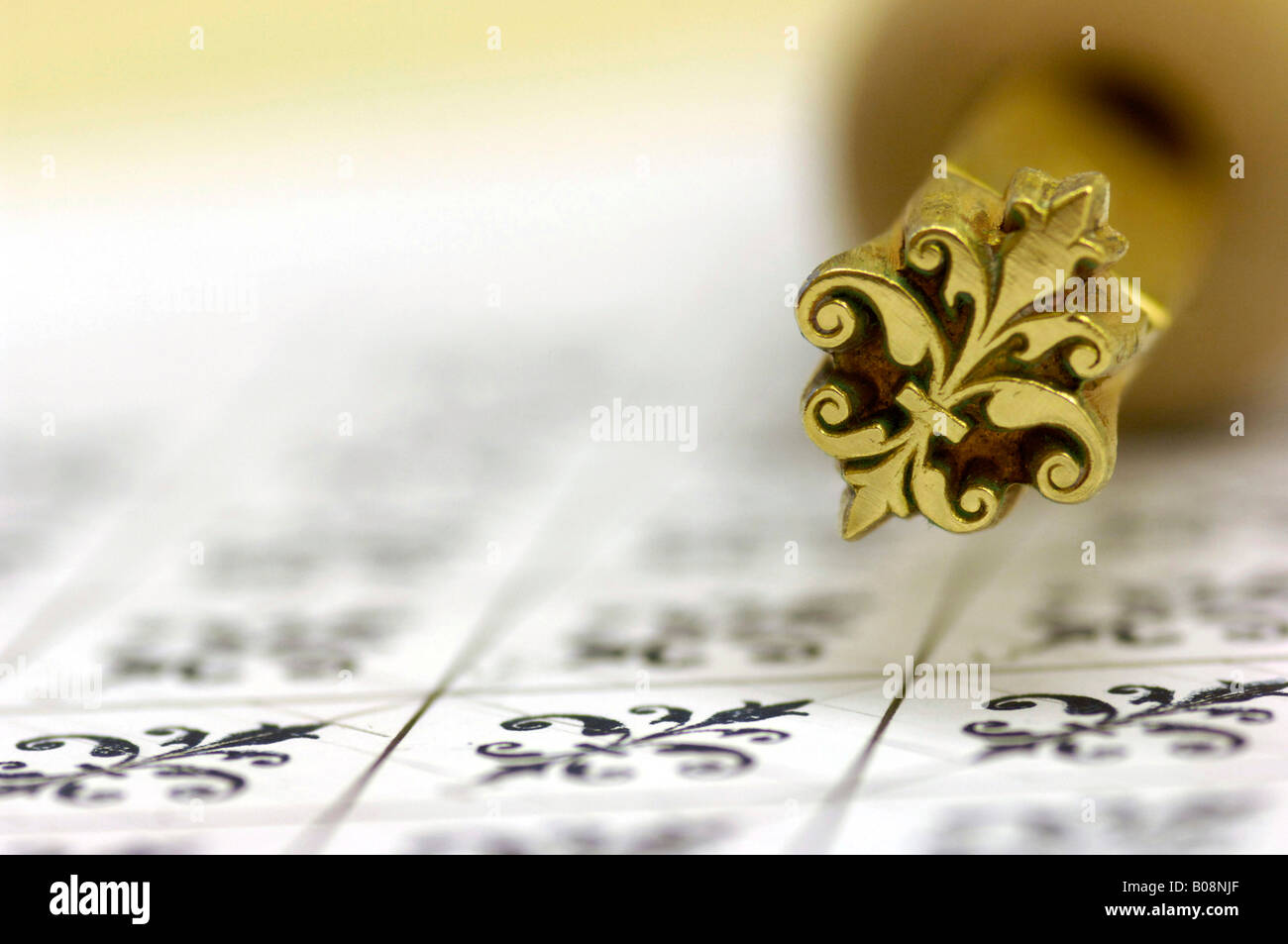 Embossing stamp and die on a blueprint pattern, leather ornament ...