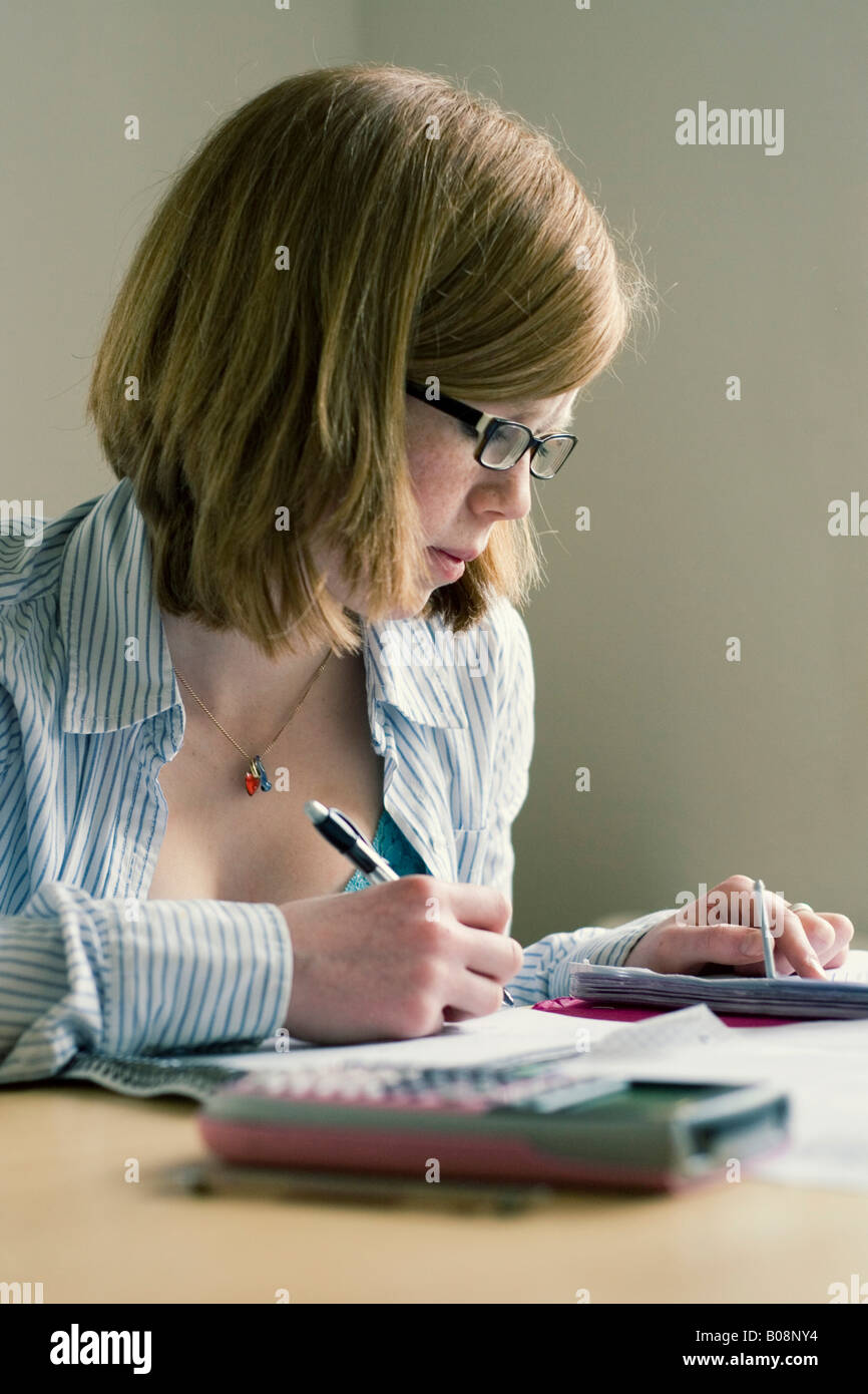 Schoolgirl doing her homework Stock Photo - Alamy