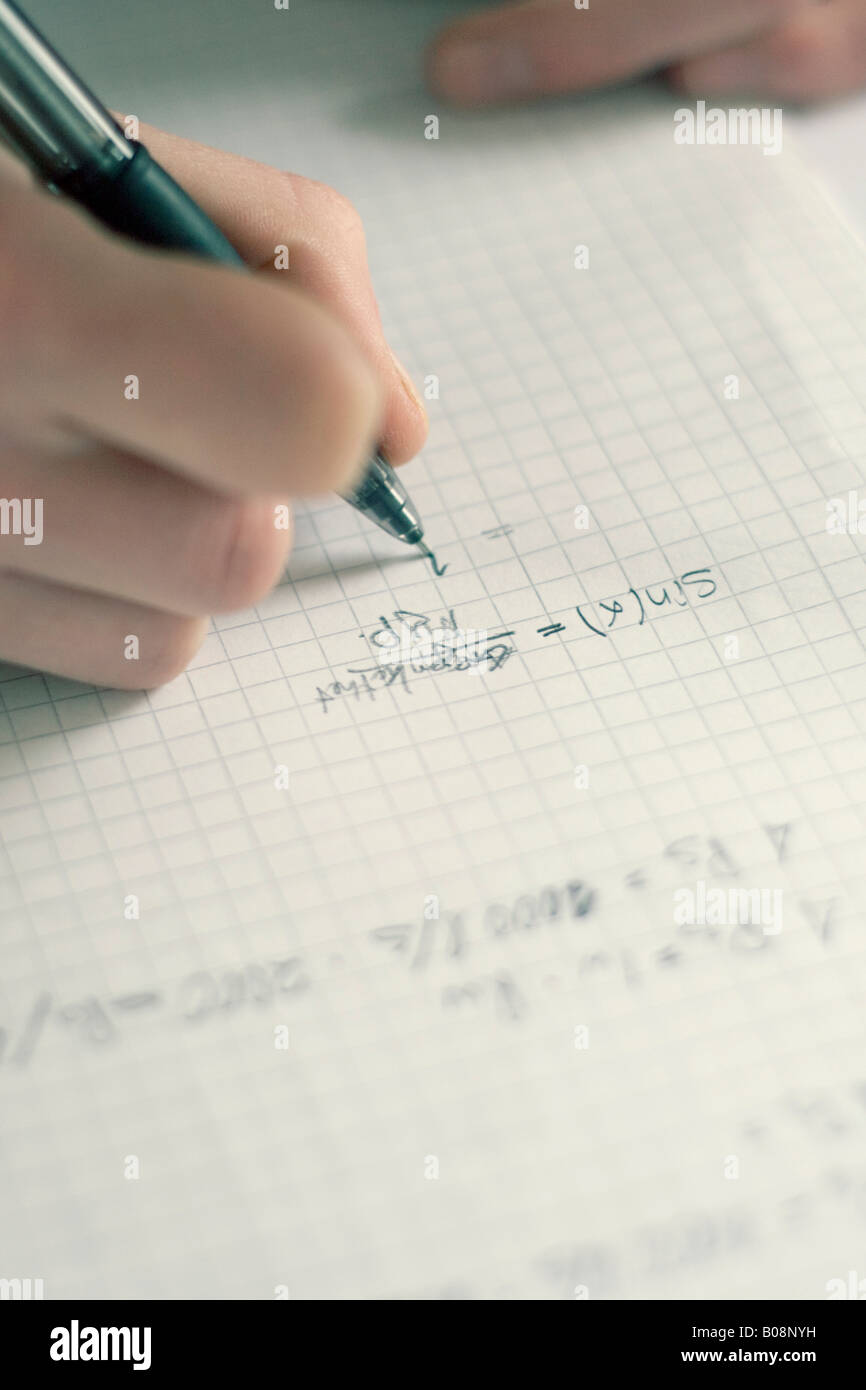 Schoolgirl doing home work, calculating, math equation Stock Photo - Alamy