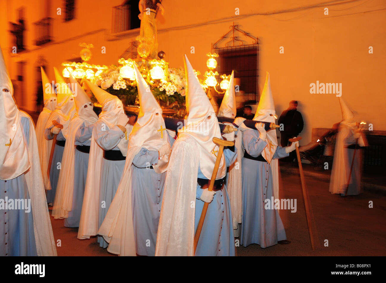 Penitents wearing penitential robes (nazareno), Holy Week procession ...