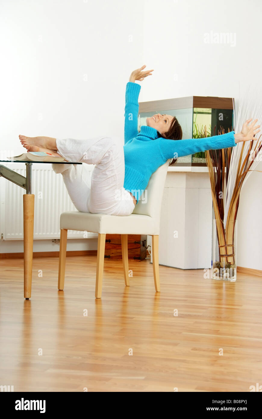 Wiht her legs on the table hi-res stock photography and images - Alamy