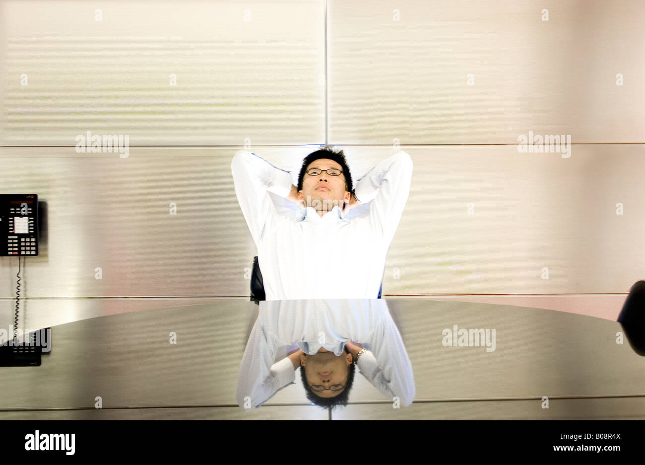 Leaning back in an arm chair hi-res stock photography and images - Alamy