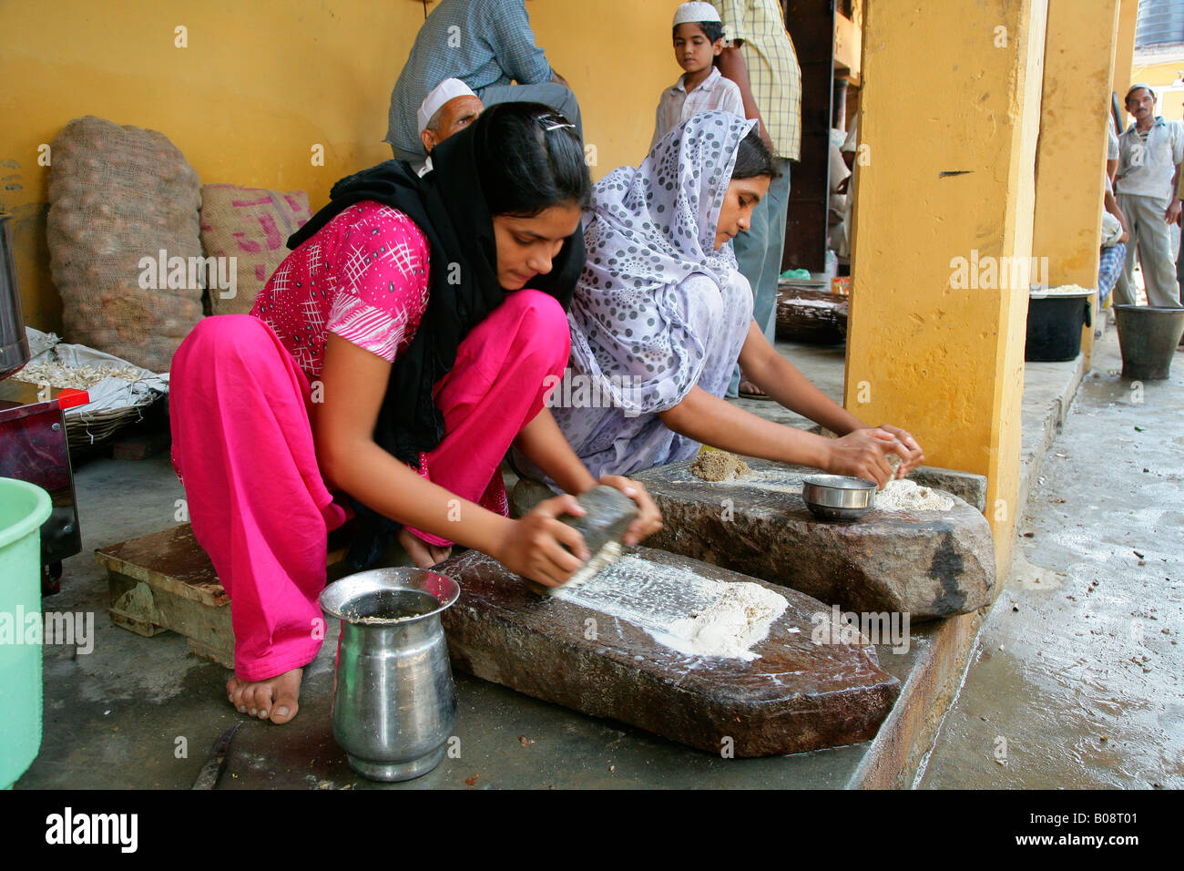 Women grinding hi-res stock photography and images - Alamy