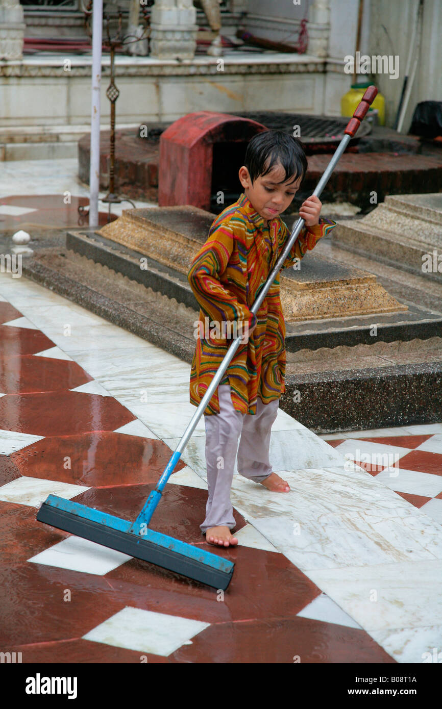 Boy cleaning a Sufi shrine, Bareilly, Uttar Pradesh, India, Asia Stock ...