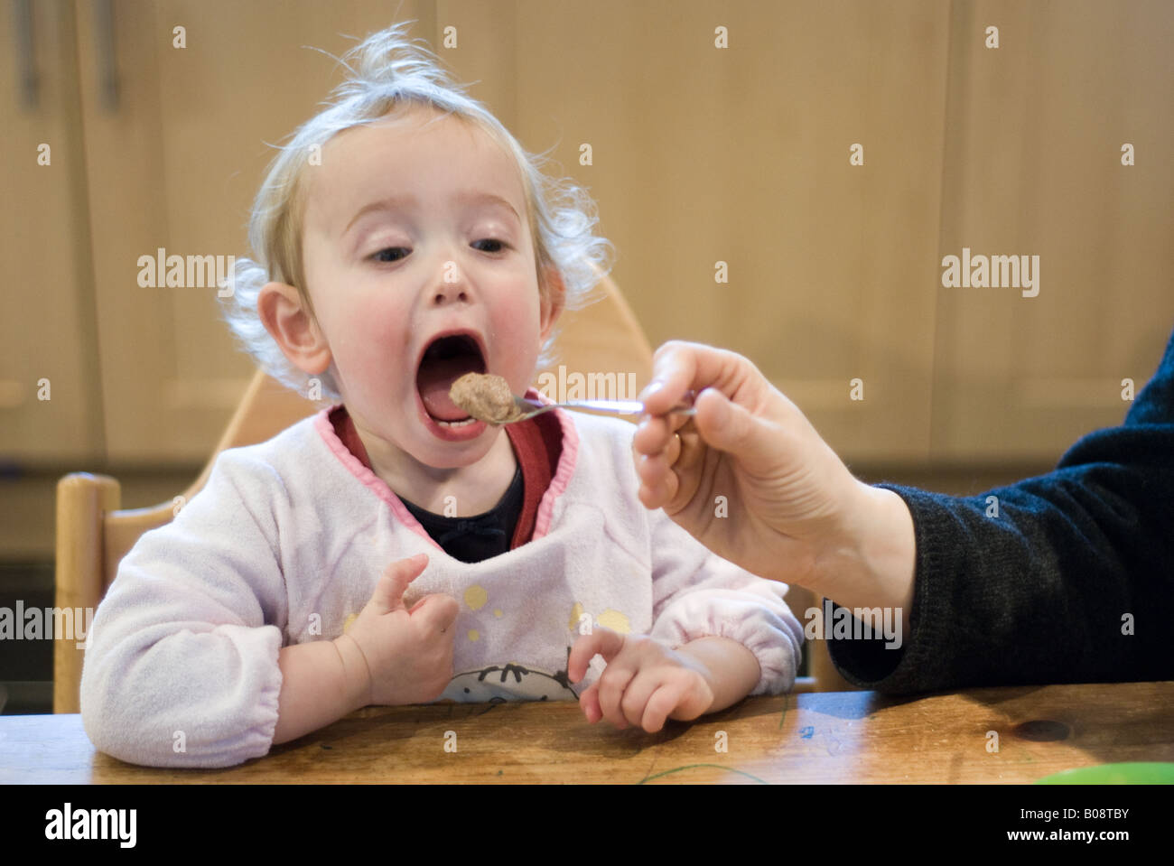 Toddler girl eating ice cream hi-res stock photography and images - Alamy
