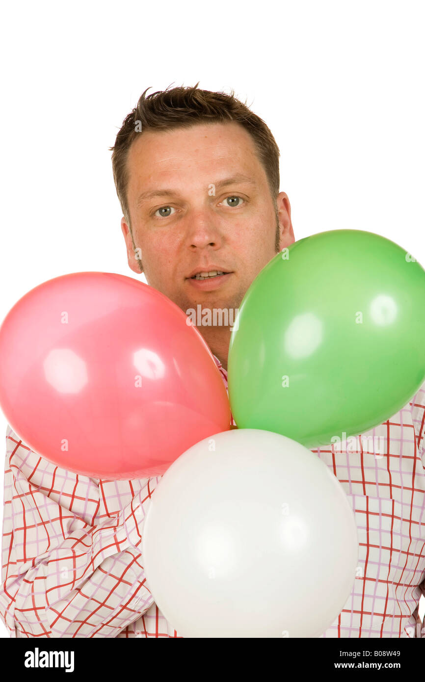 40-year-old man holding balloons Stock Photo - Alamy