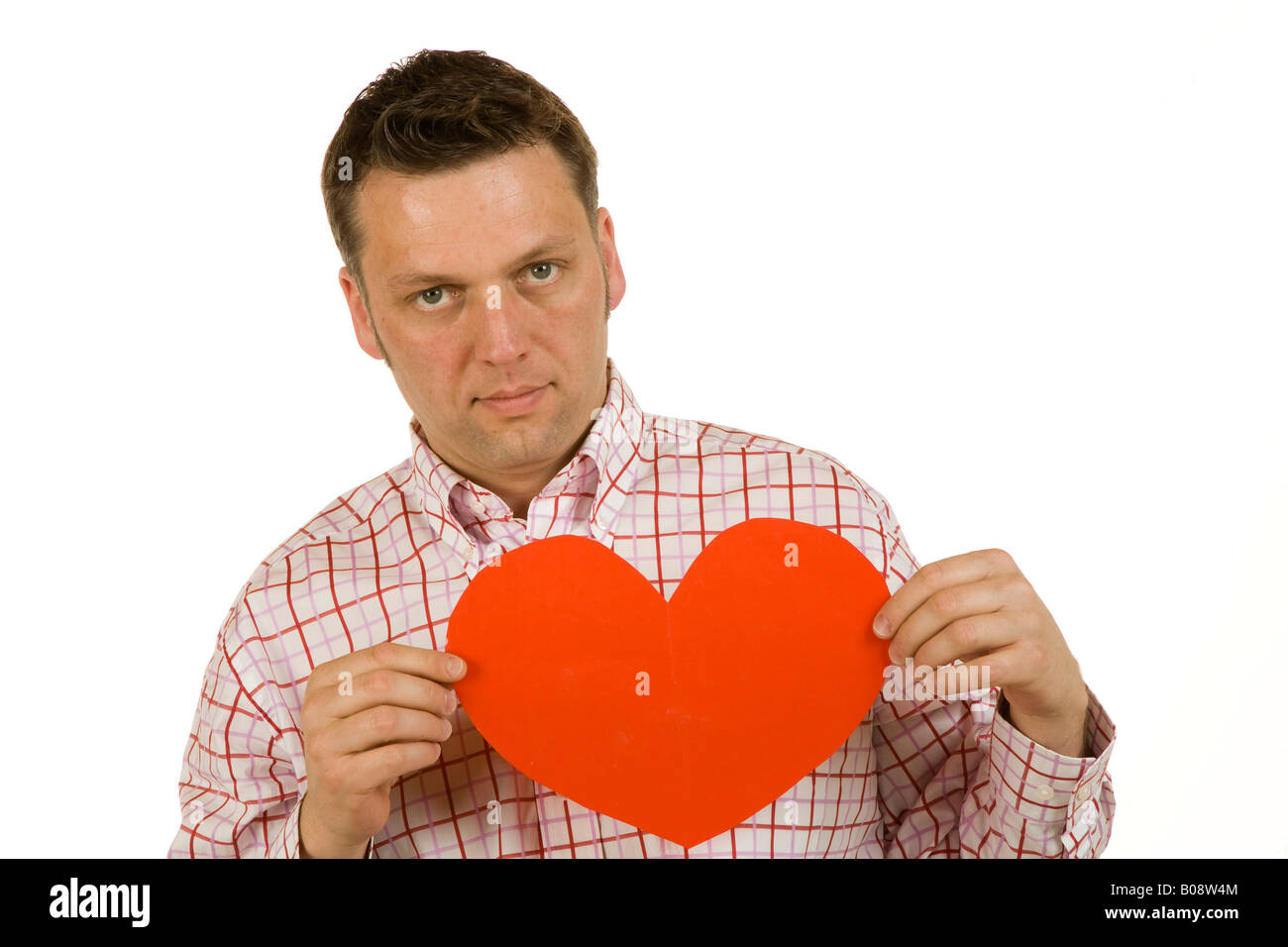 40-year-old man holding a red heart Stock Photo - Alamy
