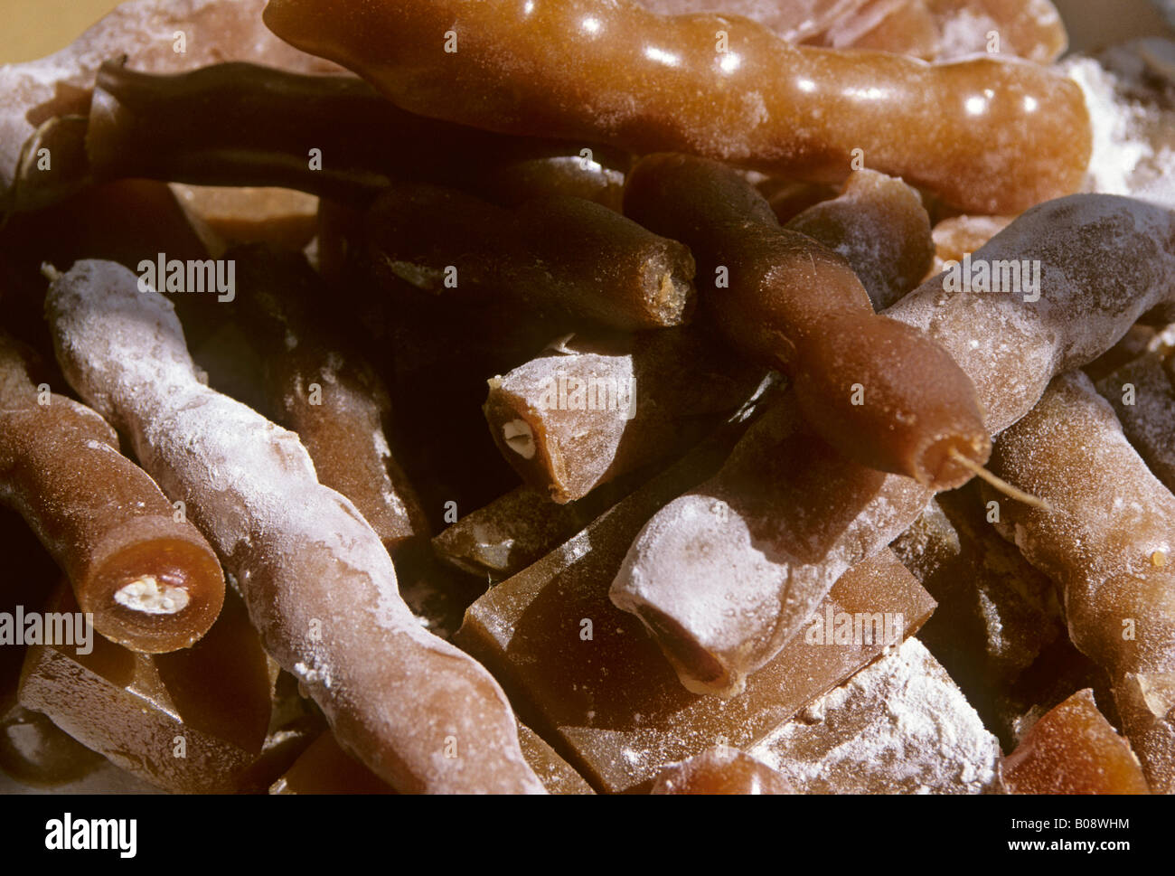 Soutzoukos, a specialty sweet made of almonds and thickened grape juice ...