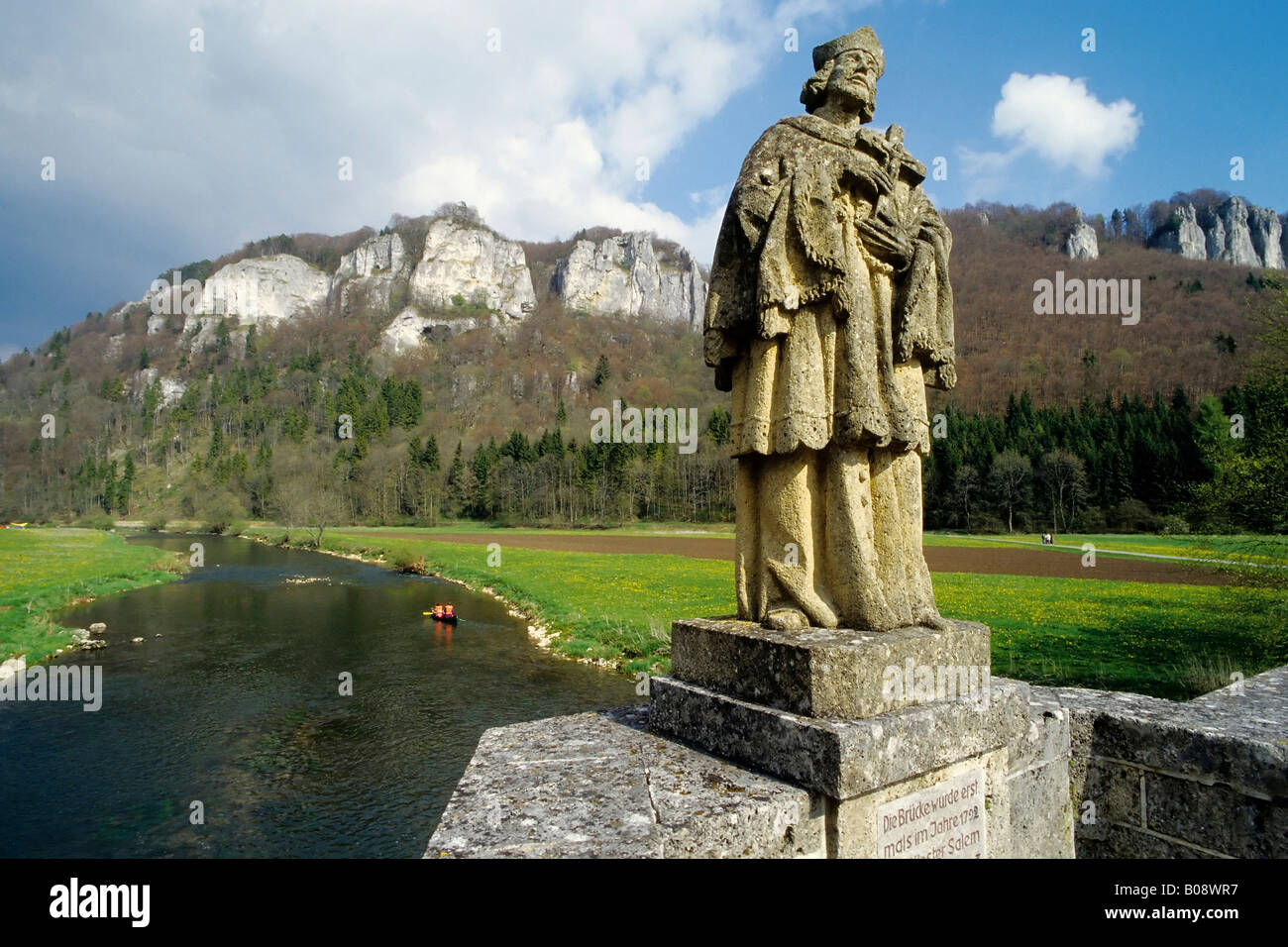 Stone statue of a saint on a bridge, Upper Danube near Hausen im Tal ...