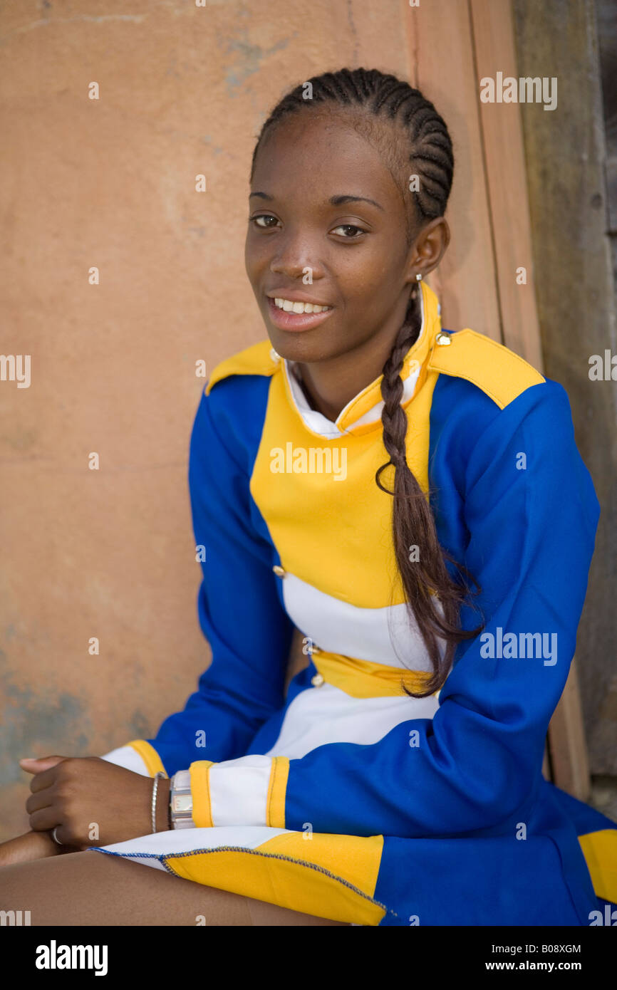 Teenage girl in marching band uniform during a break in the parade ...