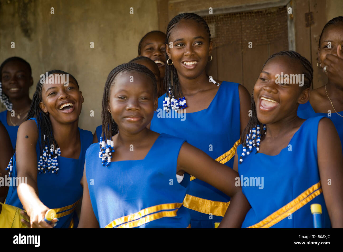 Teenage girls in marching band uniforms during a break in the parade ...