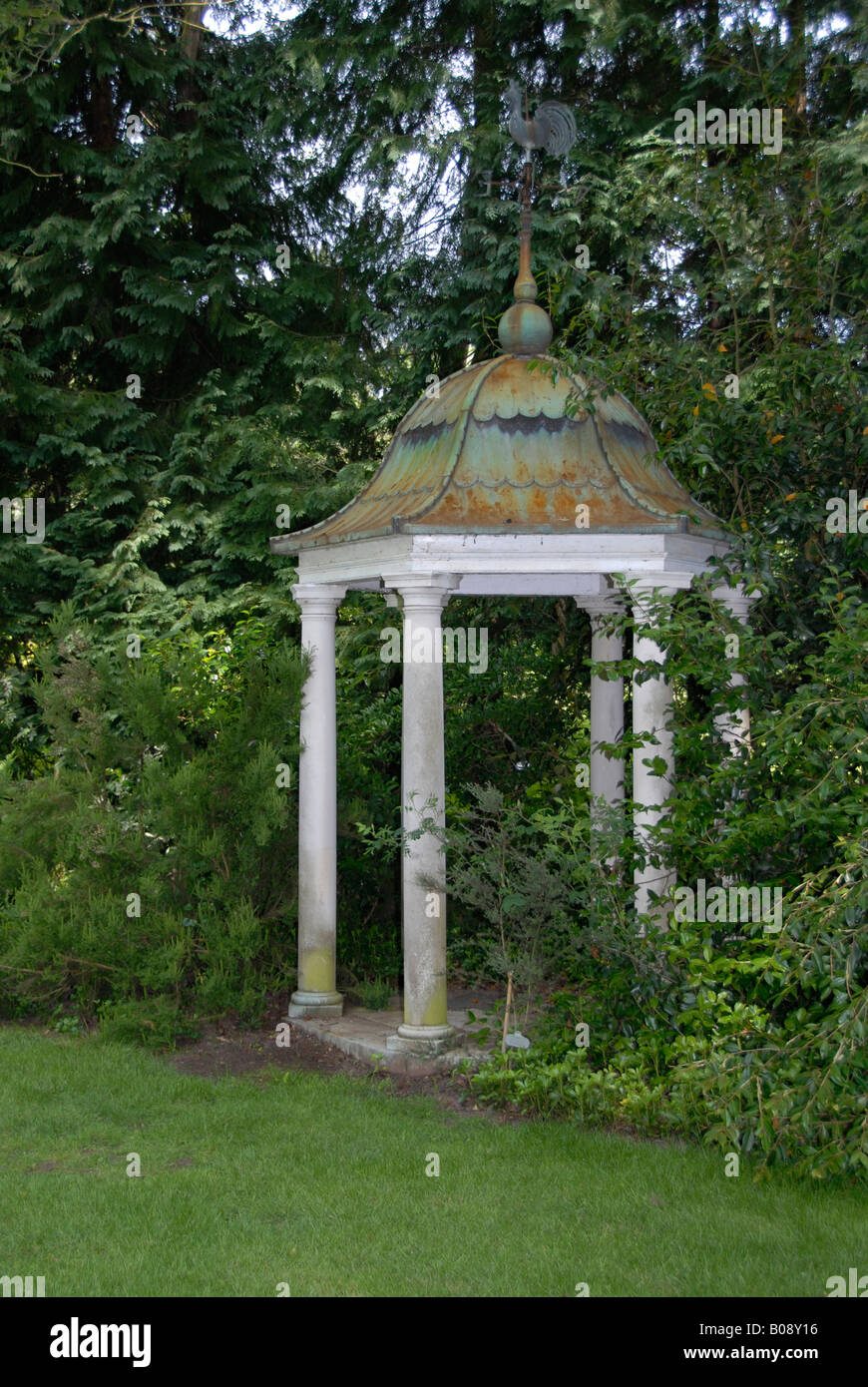 Colorful Pergola hide away in leafy English garden Stock Photo - Alamy