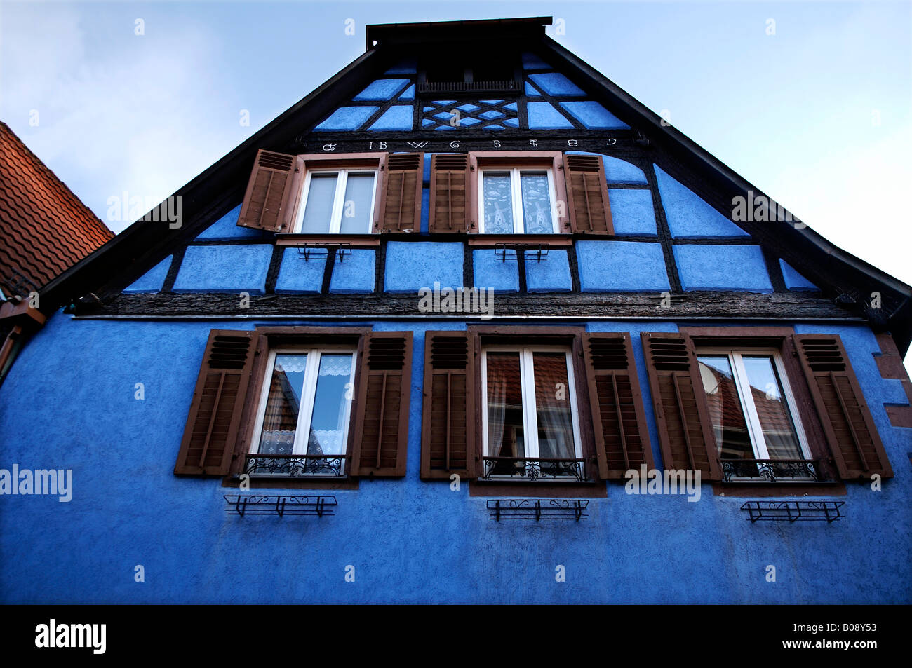 Facade of an historic blue plastered half-timbered house with window ...
