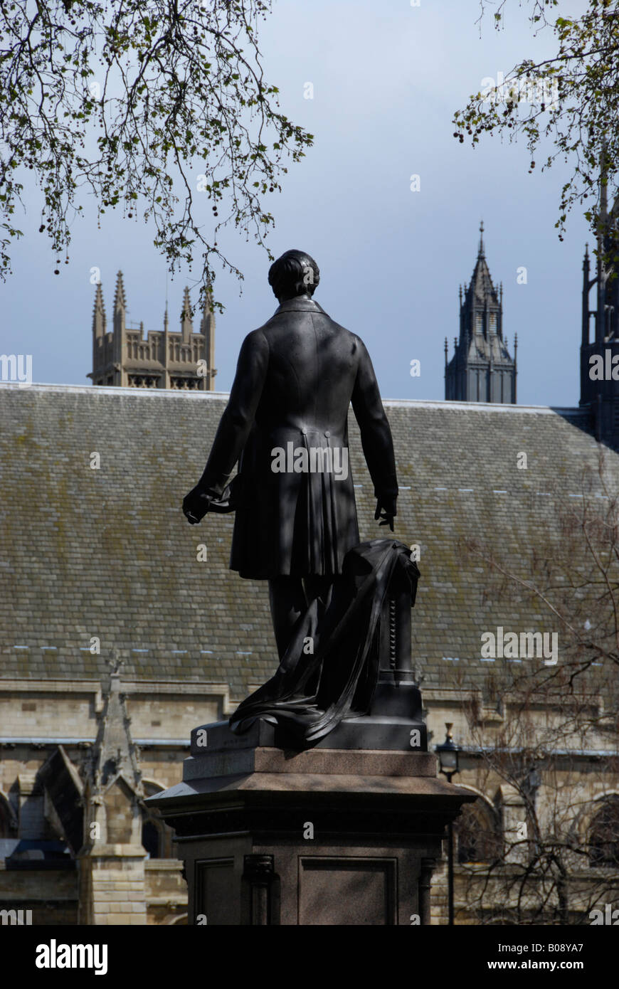 Statue of statesman and houses of parliament from Parliament Square ...
