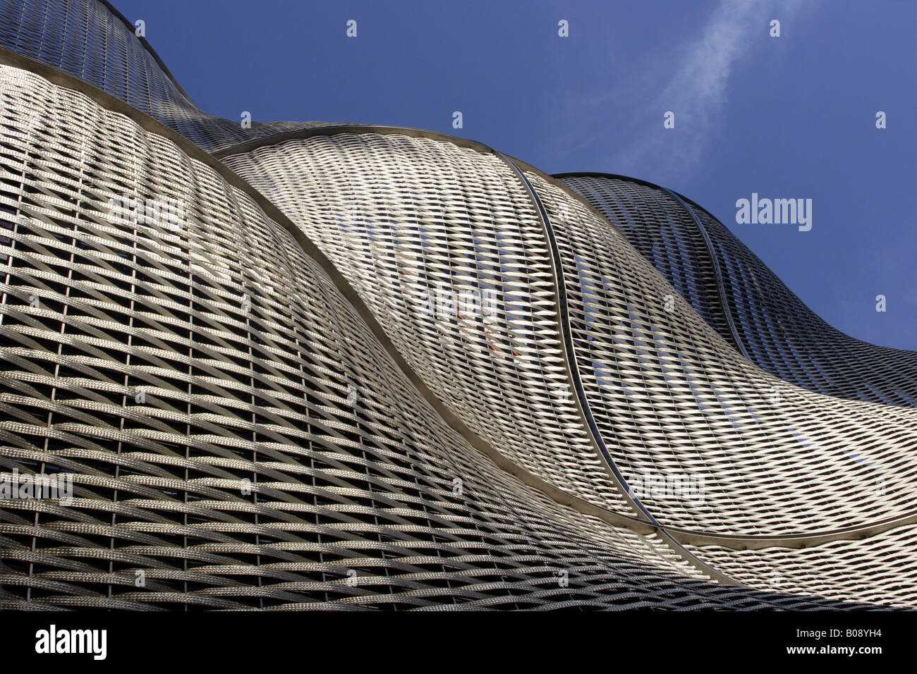 Evening sunlight making waves on an architectural facade made of steel ...