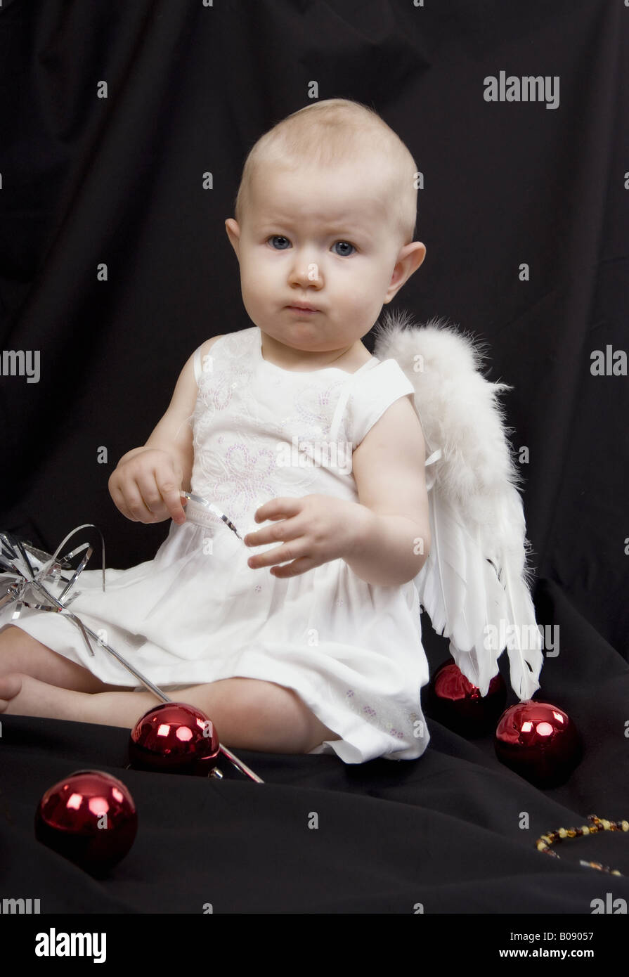 Girl wings angel sitting hi-res stock photography and images - Alamy