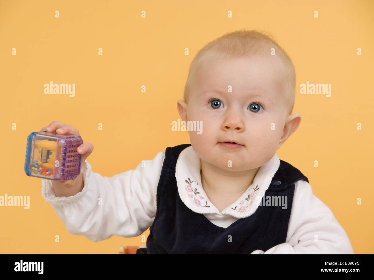 baby with rattle Stock Photo - Alamy