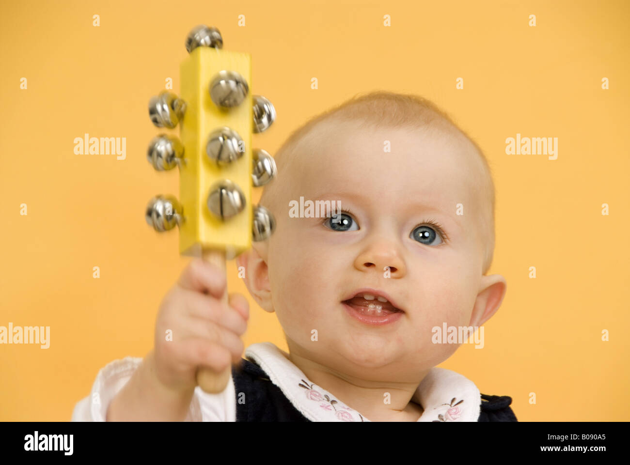 baby with rattle Stock Photo - Alamy