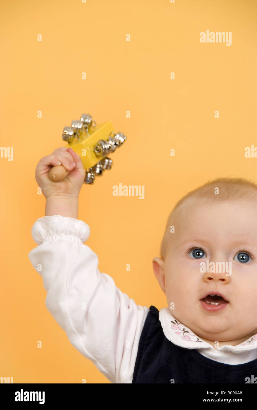 baby with rattle Stock Photo - Alamy