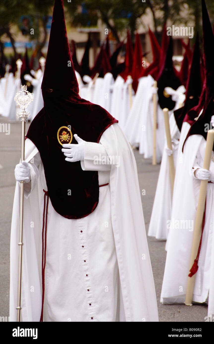 Penitents dressed in penitential robes, nazareno, Holy week procession ...