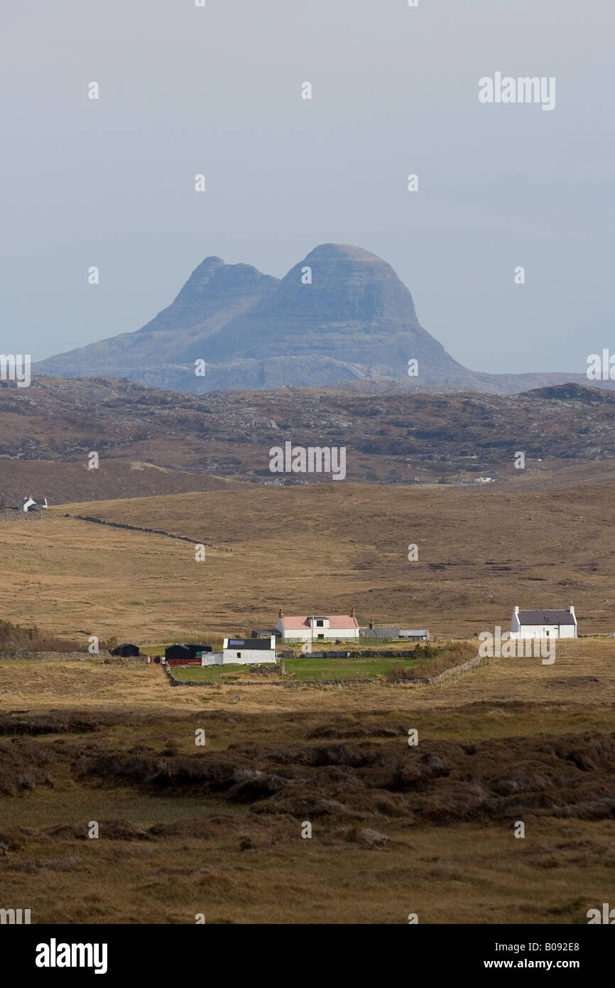 Suilven viewed from Stoer Point, with small croft houses in foreground ...