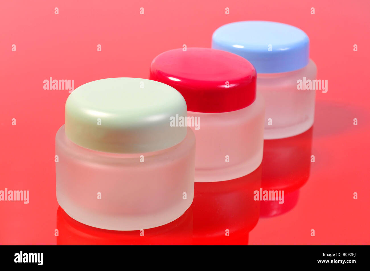 Glass cream pots Stock Photo - Alamy