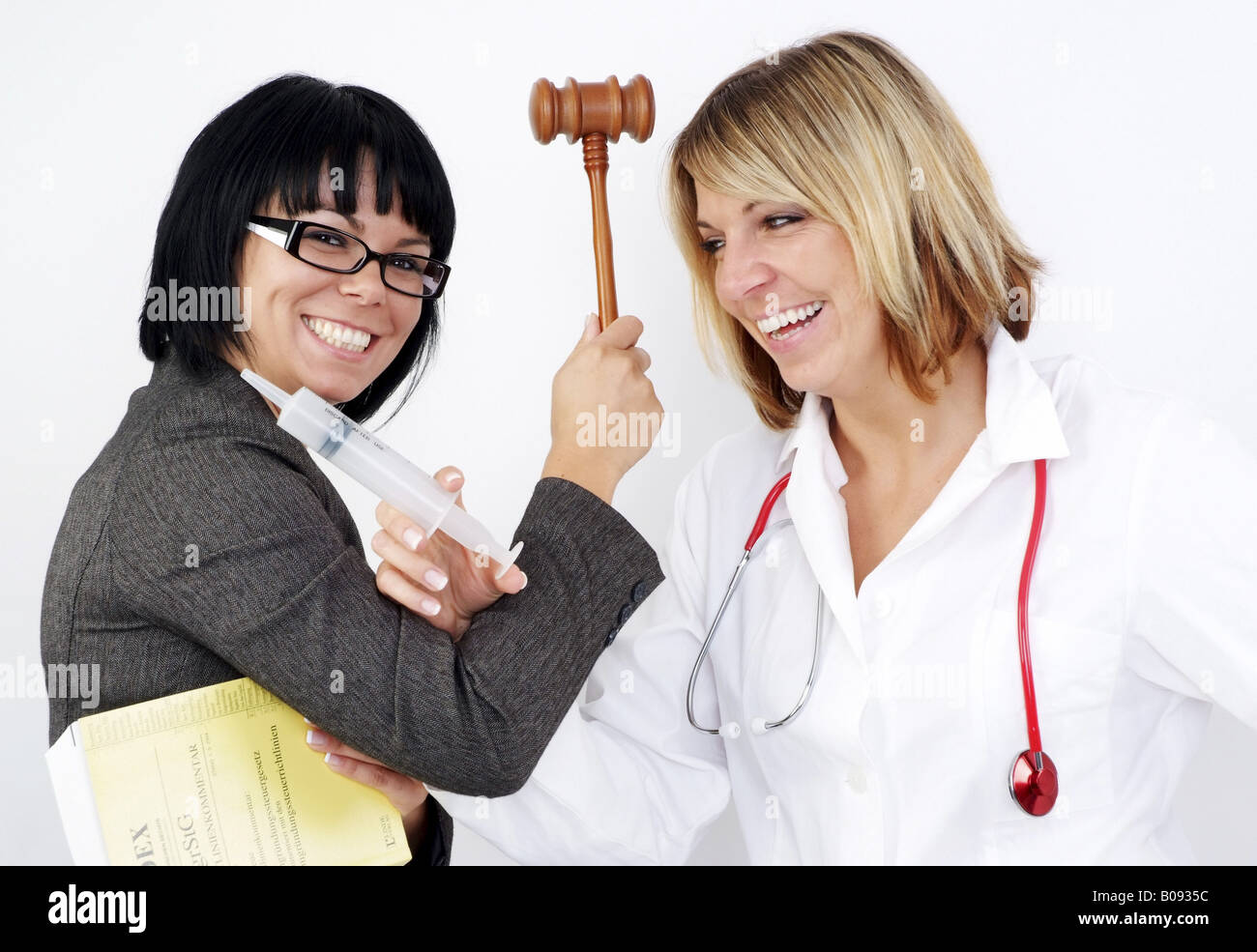 woman doctor contra woman judge Stock Photo - Alamy
