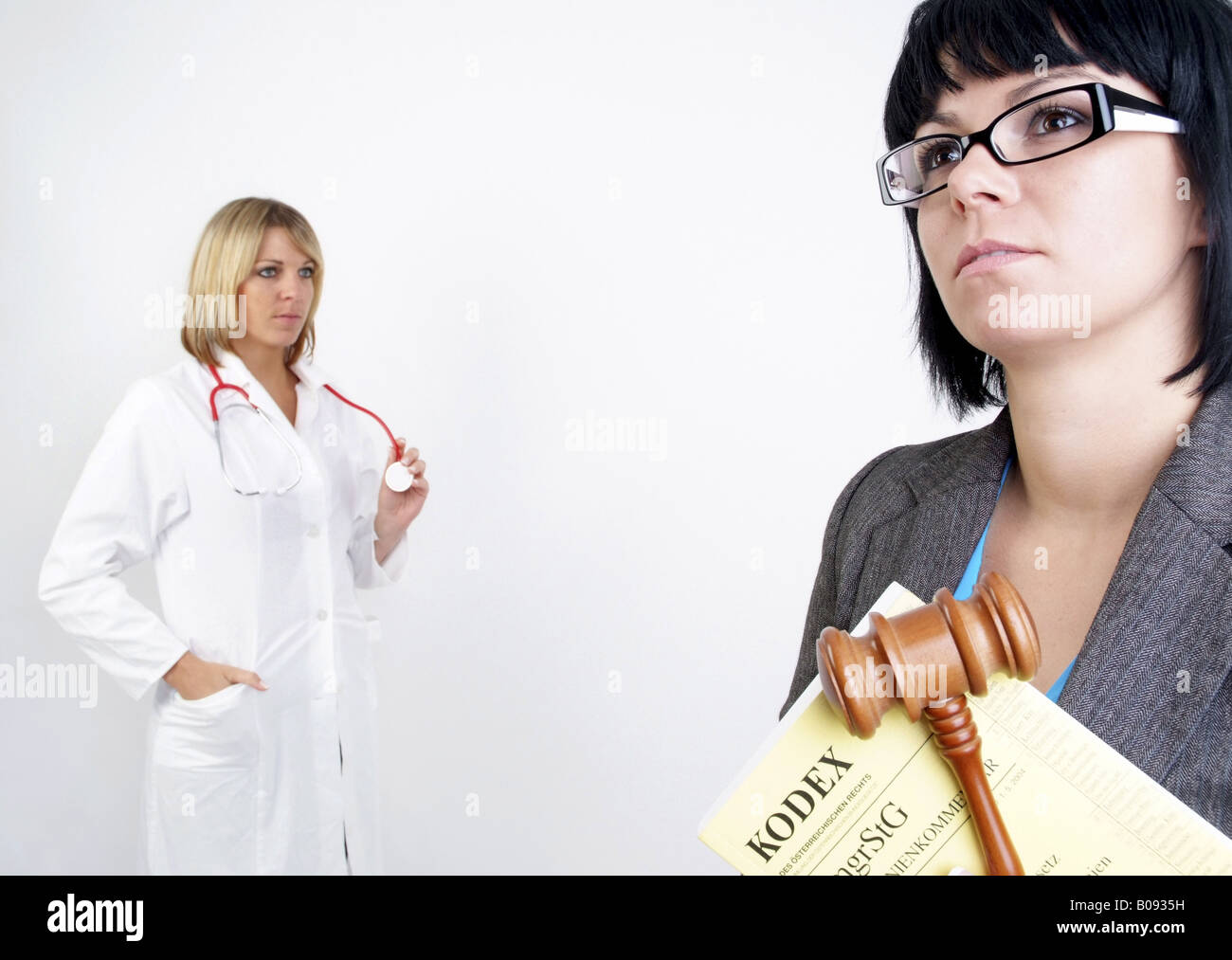 woman doctor contra woman judge Stock Photo - Alamy