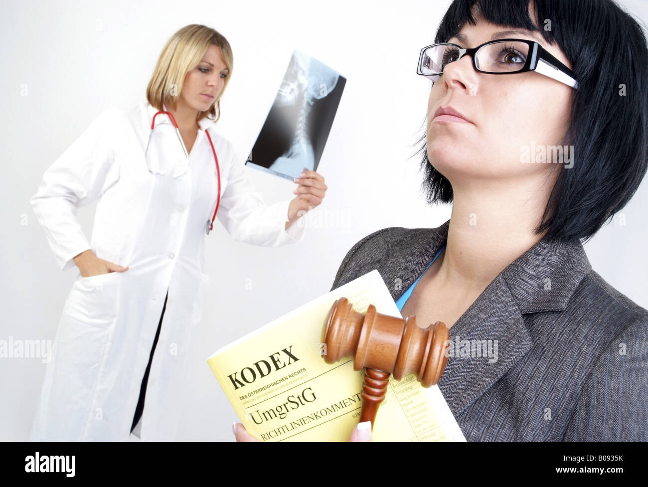 woman doctor contra woman judge Stock Photo - Alamy