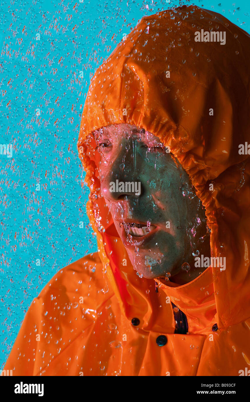 Man wearing raincoat hi-res stock photography and images - Alamy