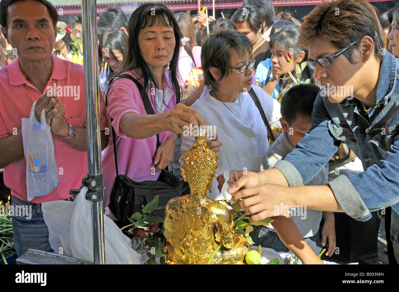 oblation of beaten gold and prayers in front of the temple of Jade ...
