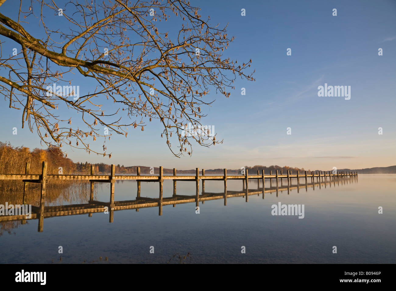 Lake Woerthsee at dawn, wooden dock, Bavaria, Germany, Europe Stock ...