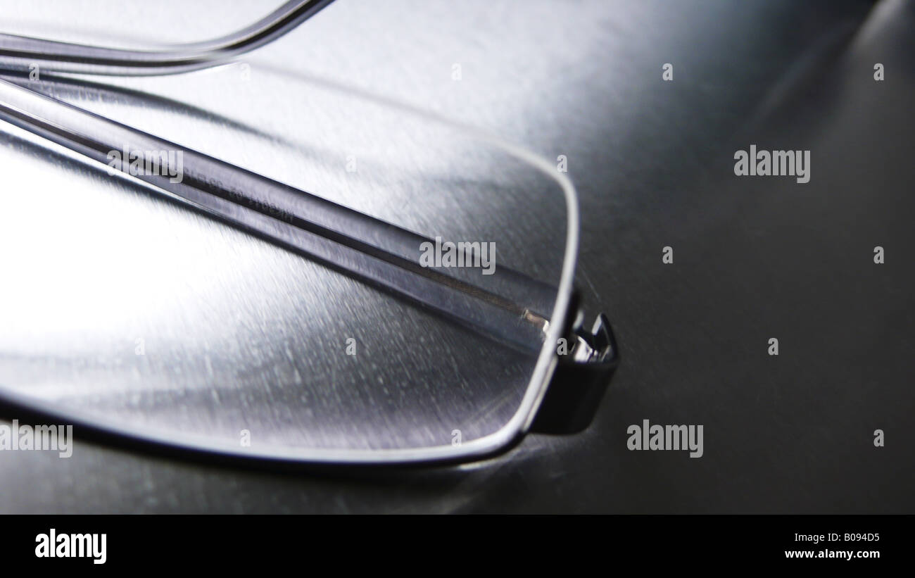 eyeglasses lying on a desk Stock Photo - Alamy