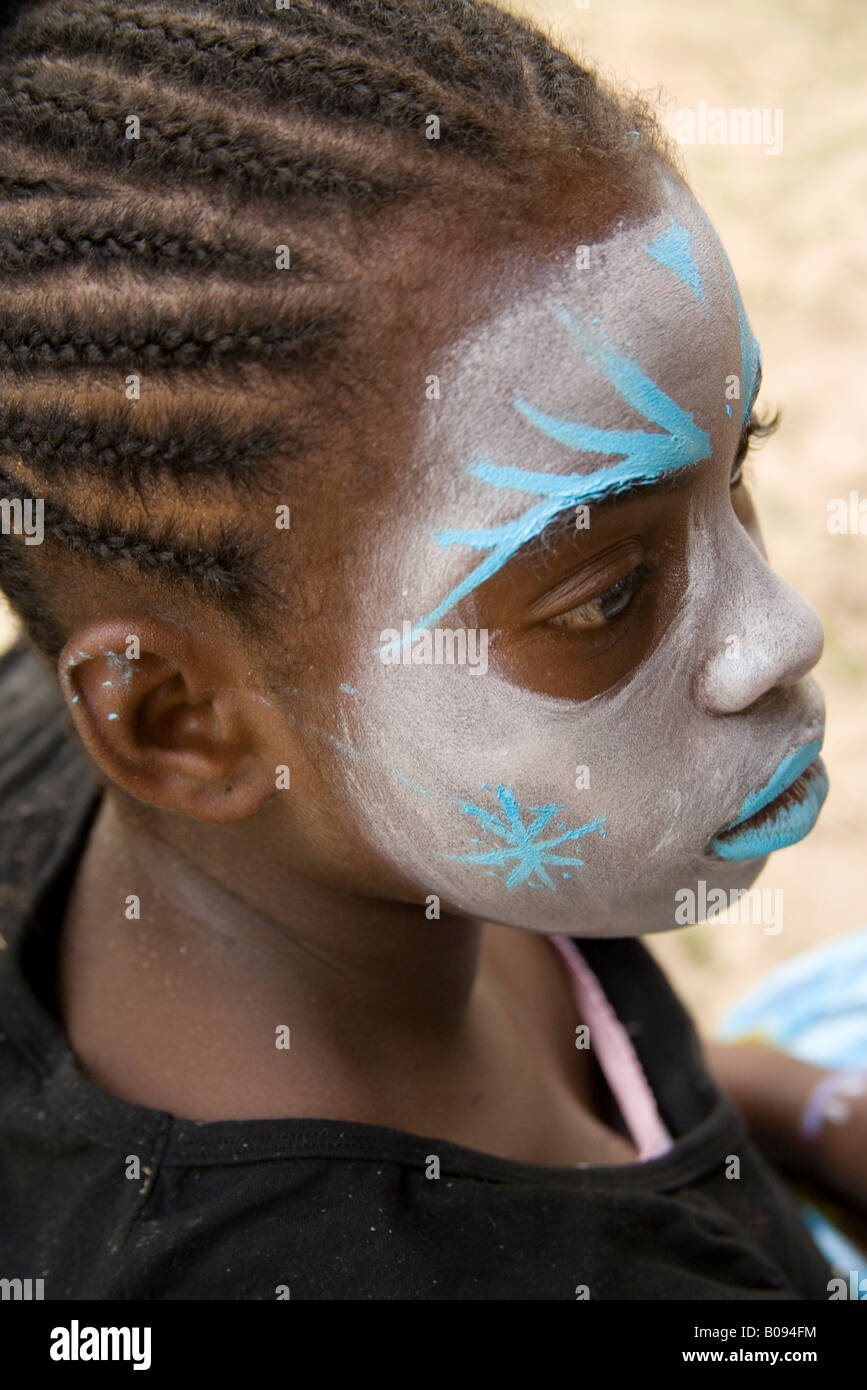 Girl (age 7) with painted face and rows of braids, Hopkins, Stann Creek ...