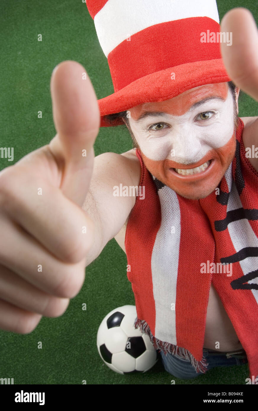 optimistic Austrian soccer fan makes thumbs up Stock Photo - Alamy
