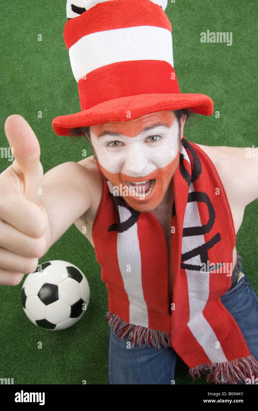 cheering Austrian soccer fan, makes thumb up Stock Photo - Alamy