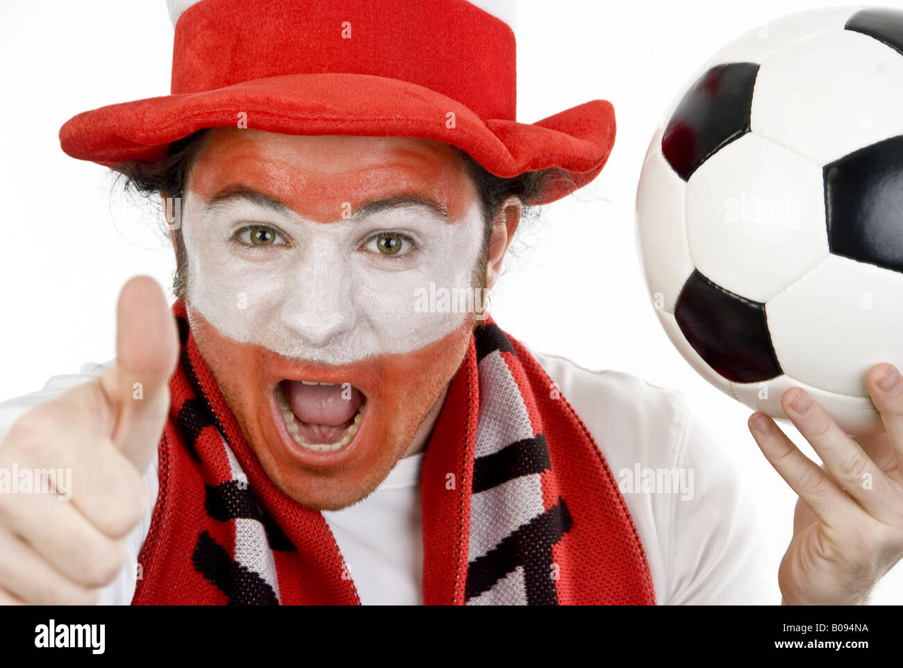 cheering Austrian soccer fan makes thumb up Stock Photo - Alamy